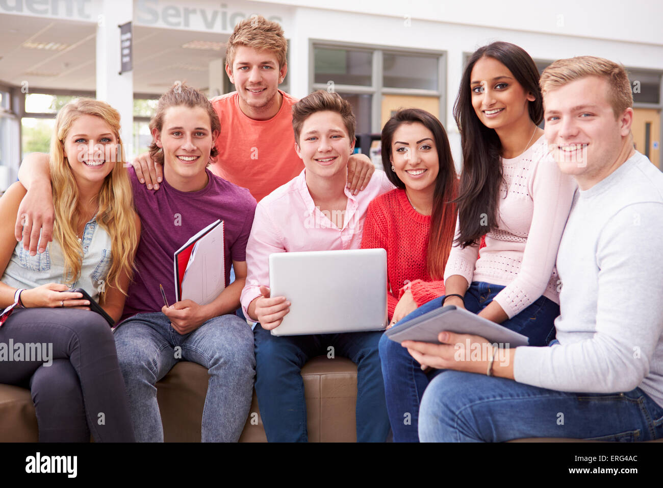 Group Of College Students Sitting And Talking Together Stock Photo - Alamy