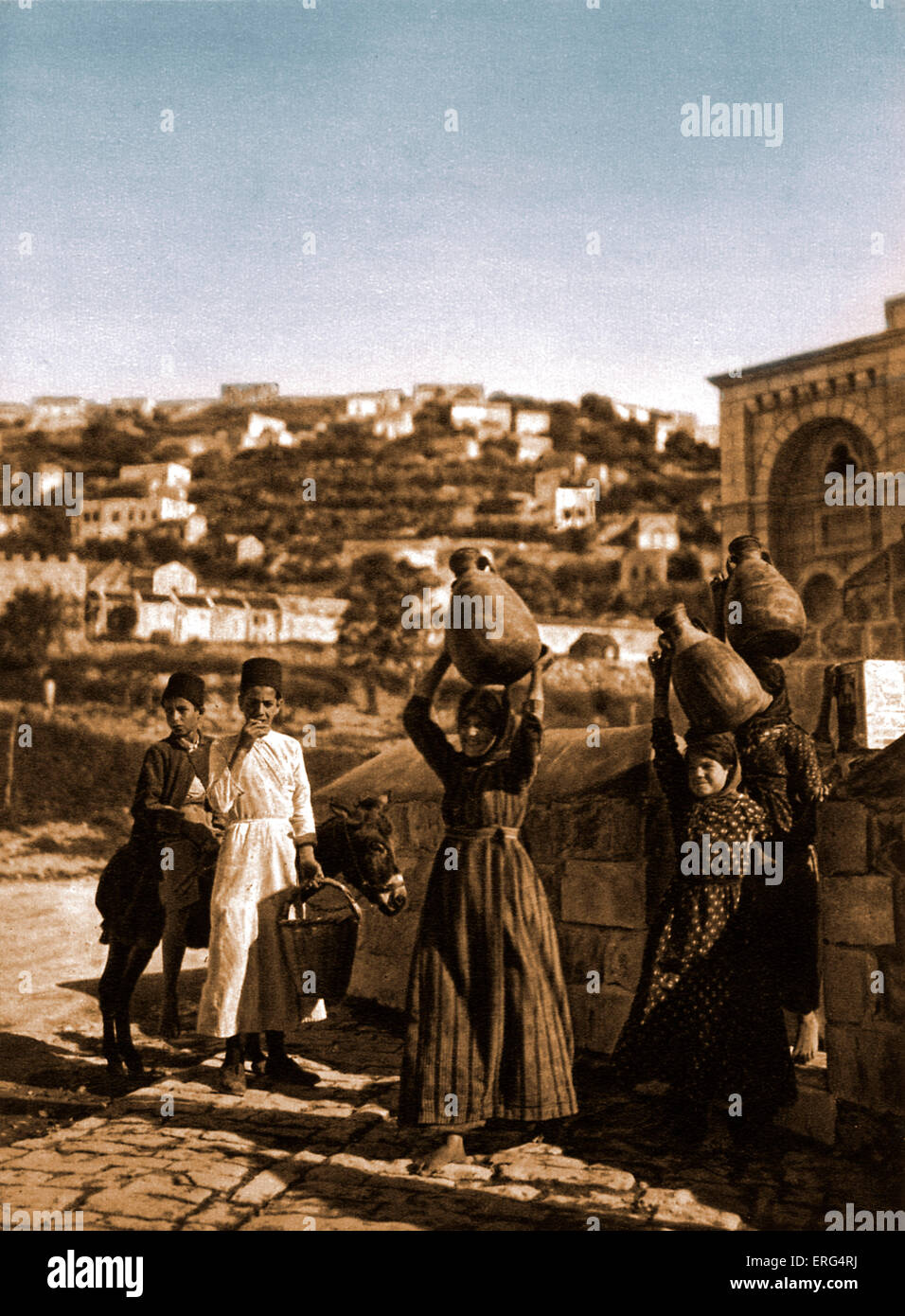 Nazareth, girls carrying water containers at Mary's Well. First ...