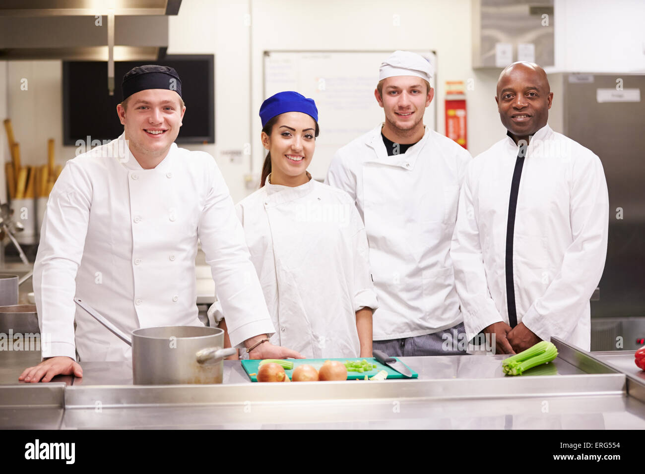 Portrait Of Teacher With Students In College Catering Class Stock Photo ...