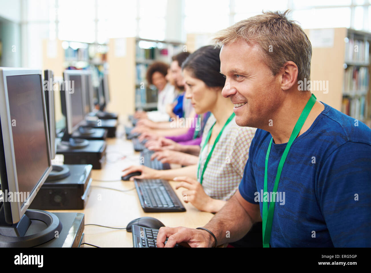 Group Of Mature Students Working At Computers Stock Photo - Alamy
