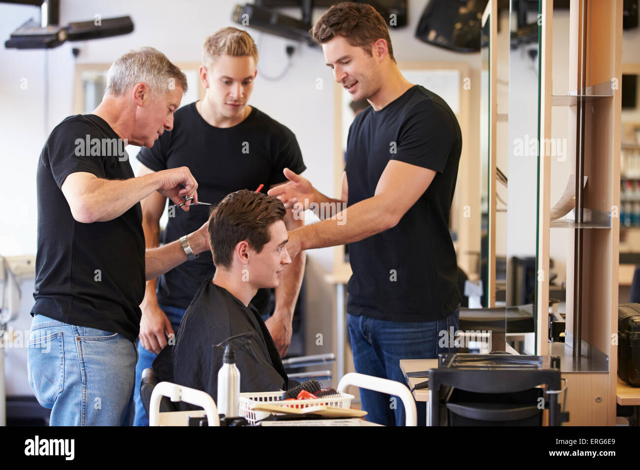 Teacher Training Mature Students In Hairdressing Stock Photo - Alamy