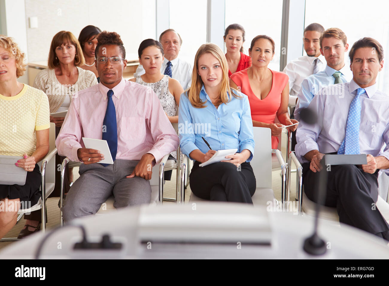 Female delegate listening presentation conference hi-res stock ...