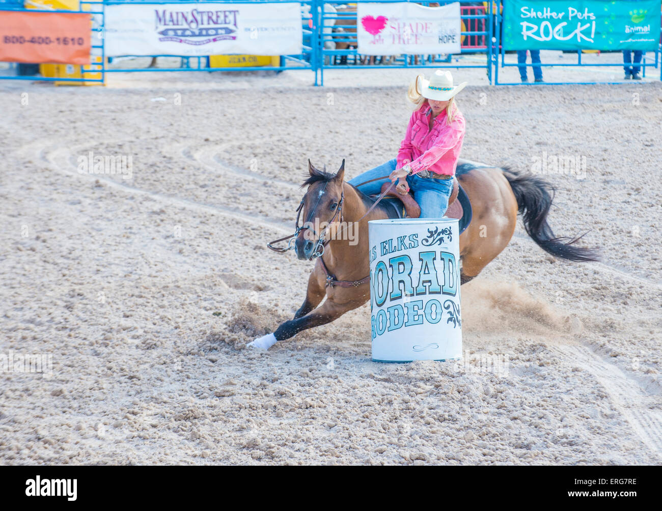 Cowgirl Participating in a Barrel racing competition at the Helldorado ...