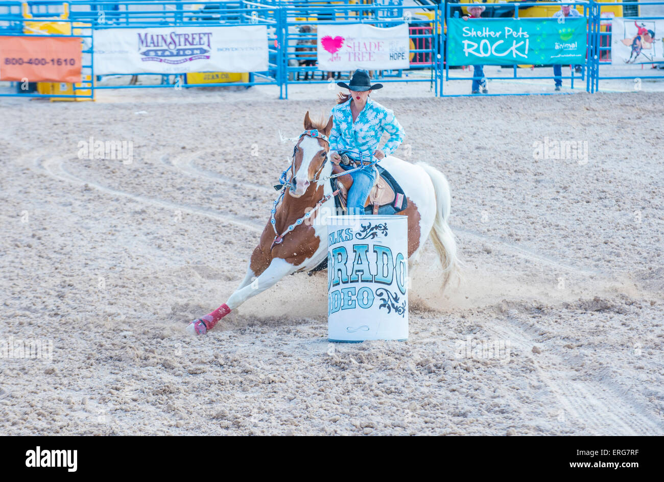 Cowgirl Participating in a Barrel racing competition at the Helldorado ...