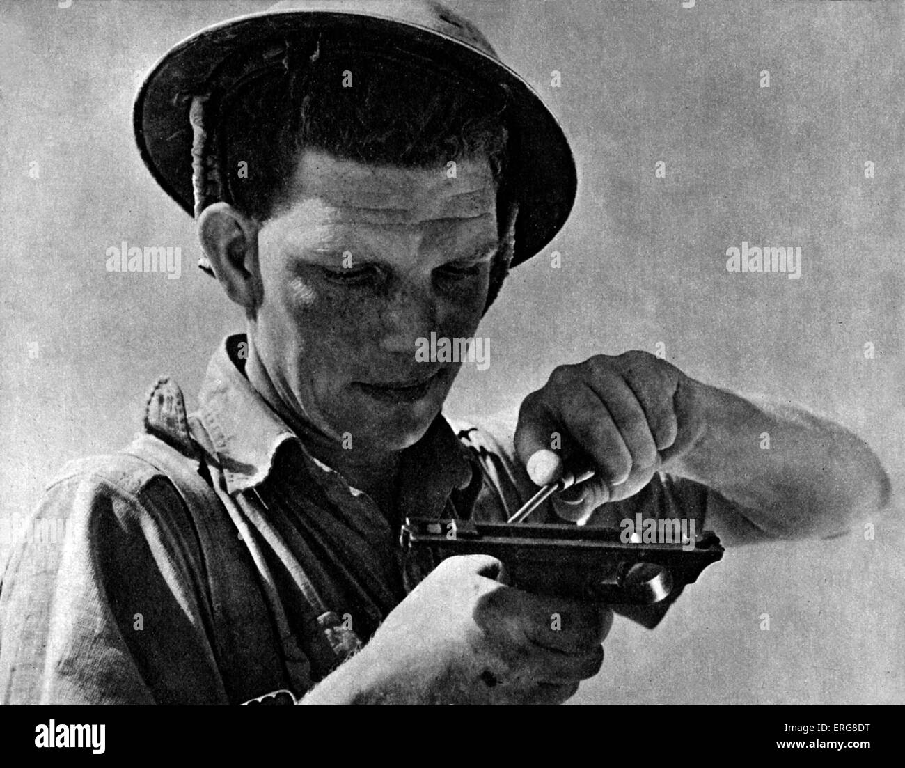The Eighth Army - WWII. Soldier from the Eighth Army cleaning his gun ... The Eighth Army - WWII. Soldier from the Eighth Army cleaning his gun ...