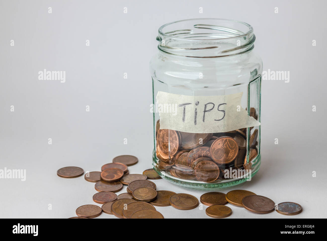 Jar for tips with euro cents coins Stock Photo - Alamy