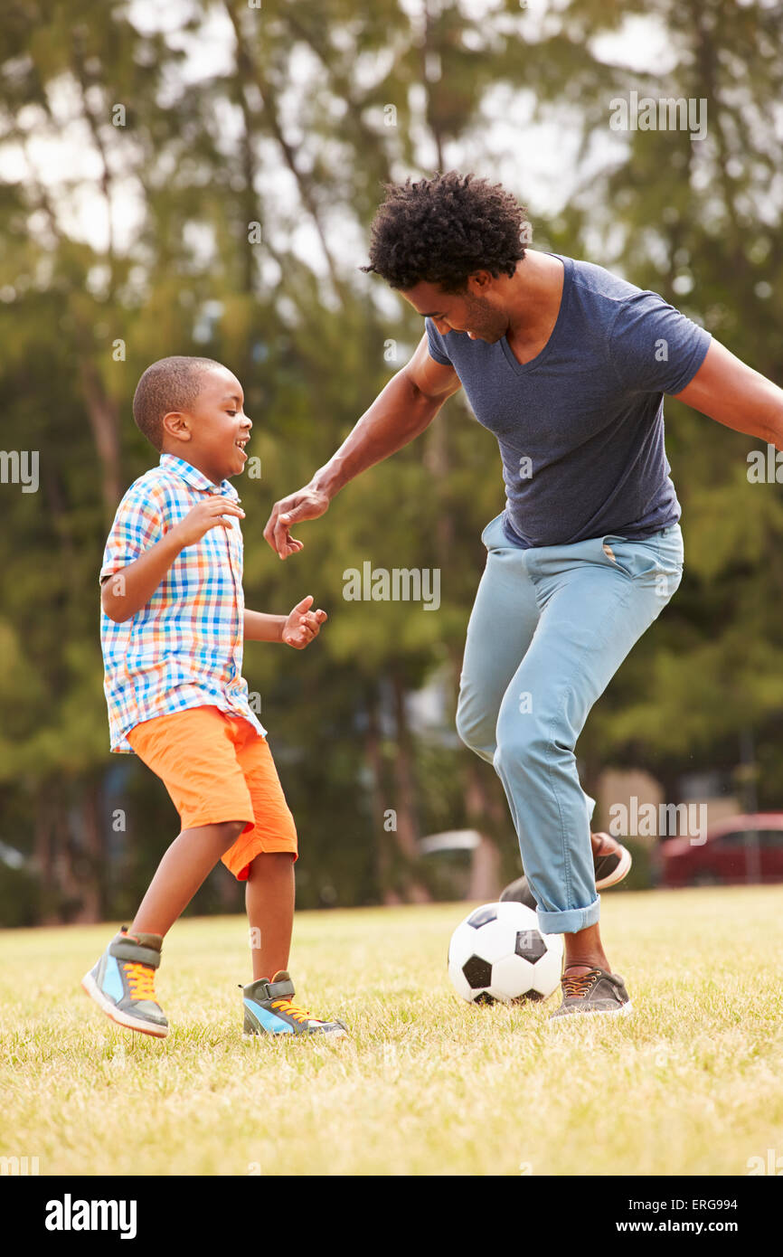 Father With Son Playing Soccer In Park Together Stock Photo - Alamy