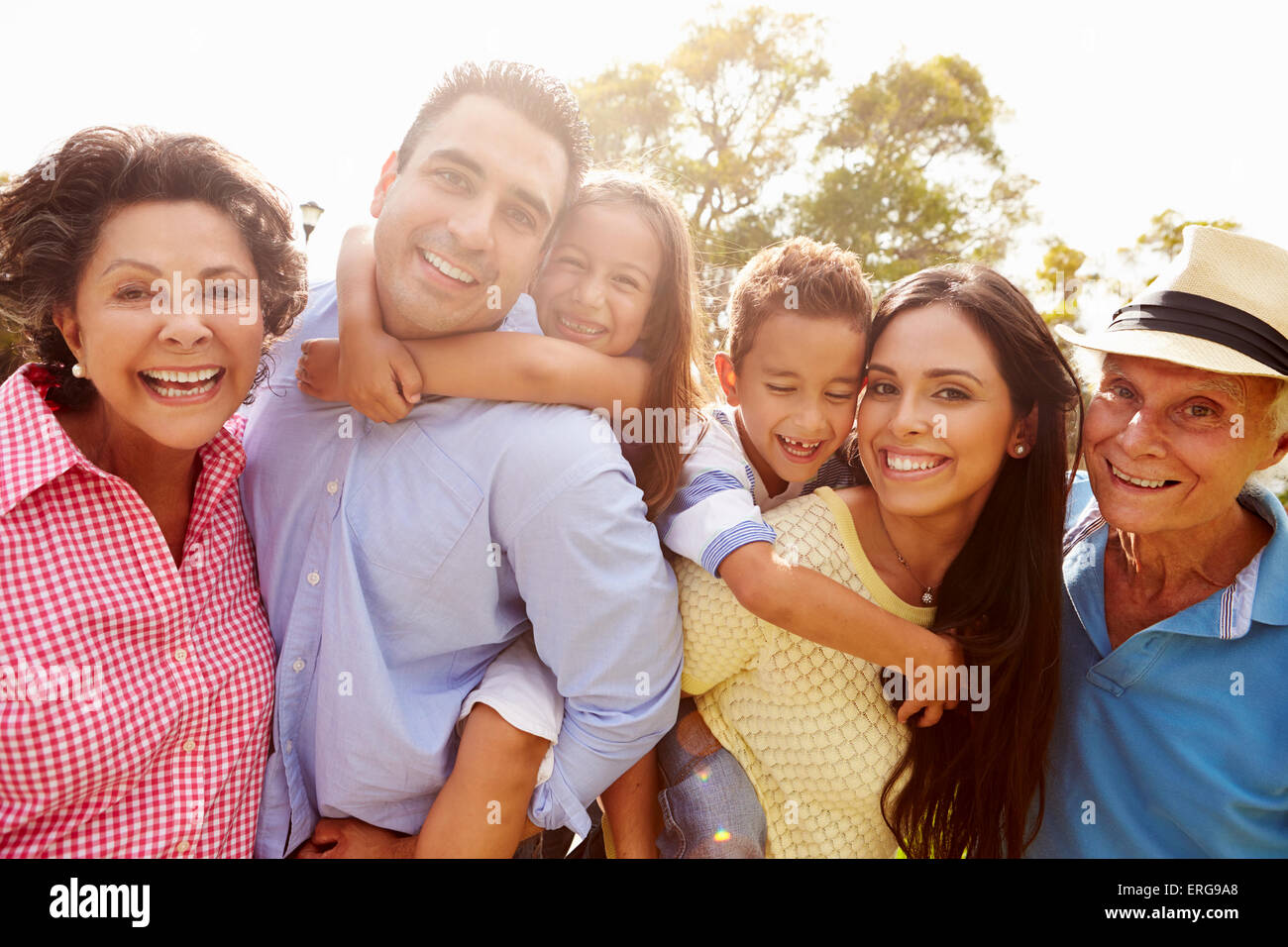Multi Generation Family Having Fun In Garden Together Stock Photo - Alamy