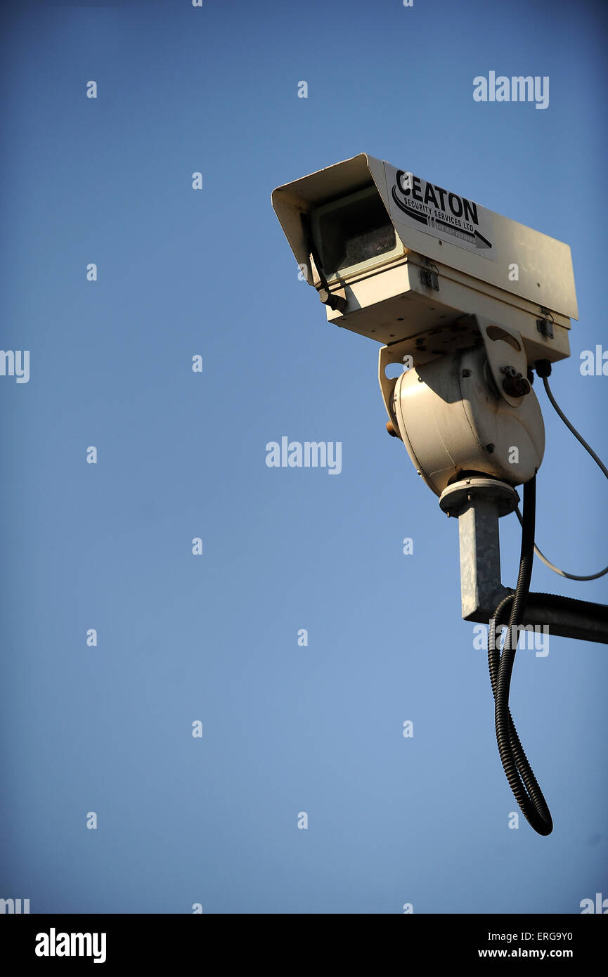 A CCTV security camera against a blue sky Stock Photo - Alamy