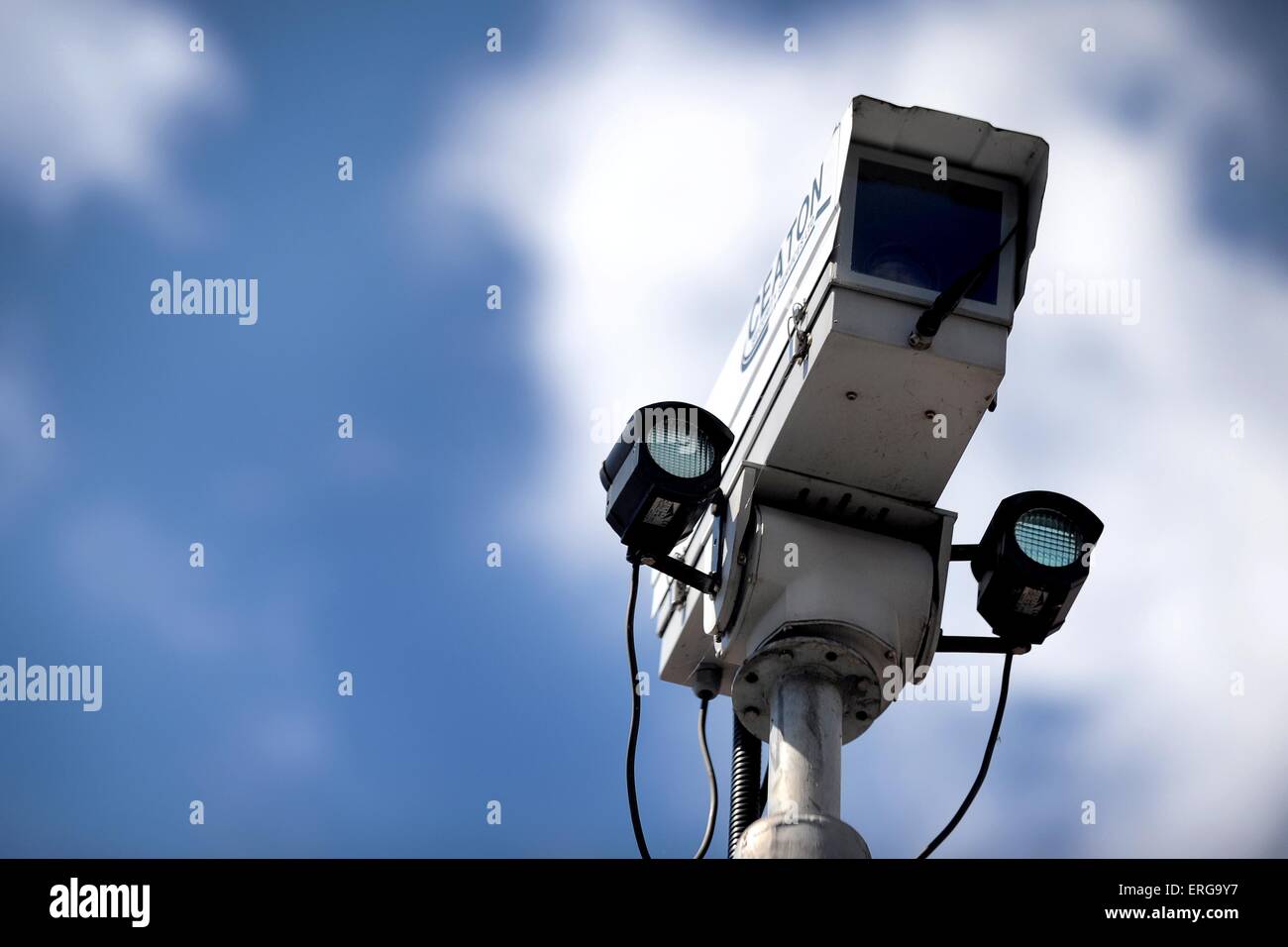 A CCTV security camera against a blue sky Stock Photo - Alamy