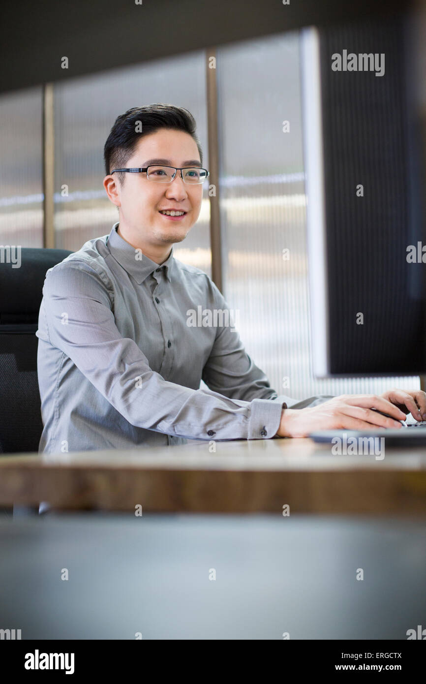 IT worker working in office Stock Photo - Alamy
