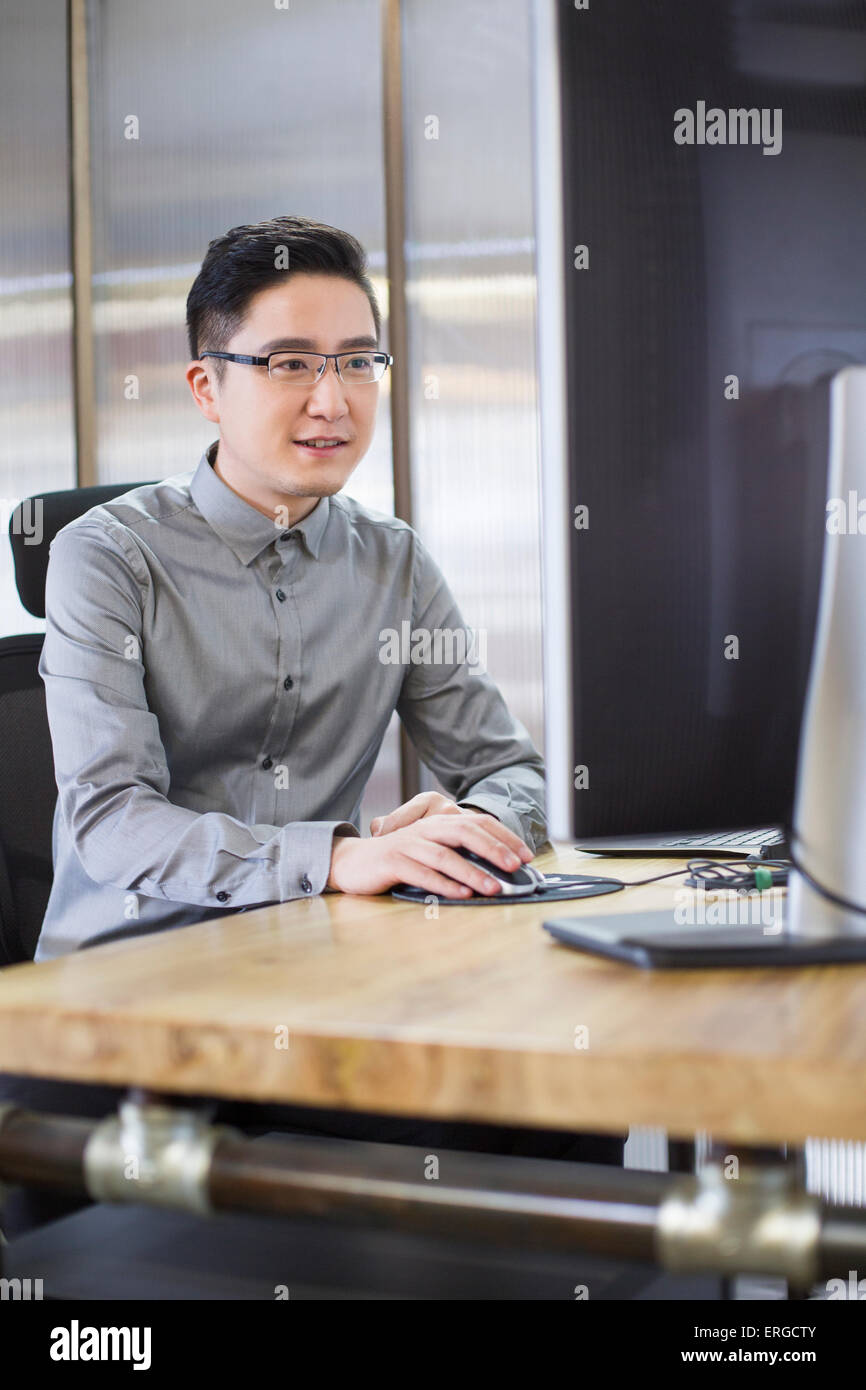 IT worker working in office Stock Photo - Alamy