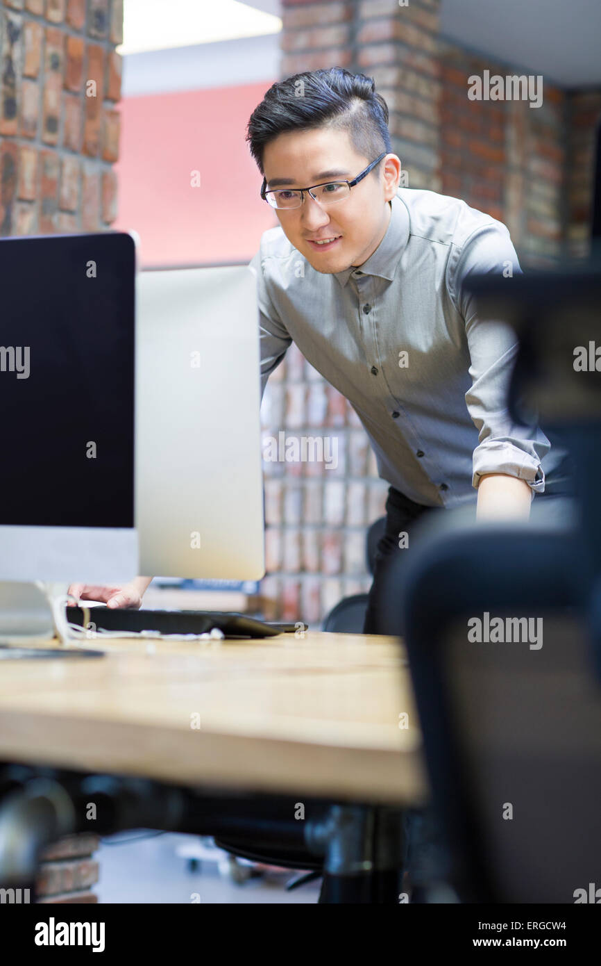 IT worker working in office Stock Photo - Alamy