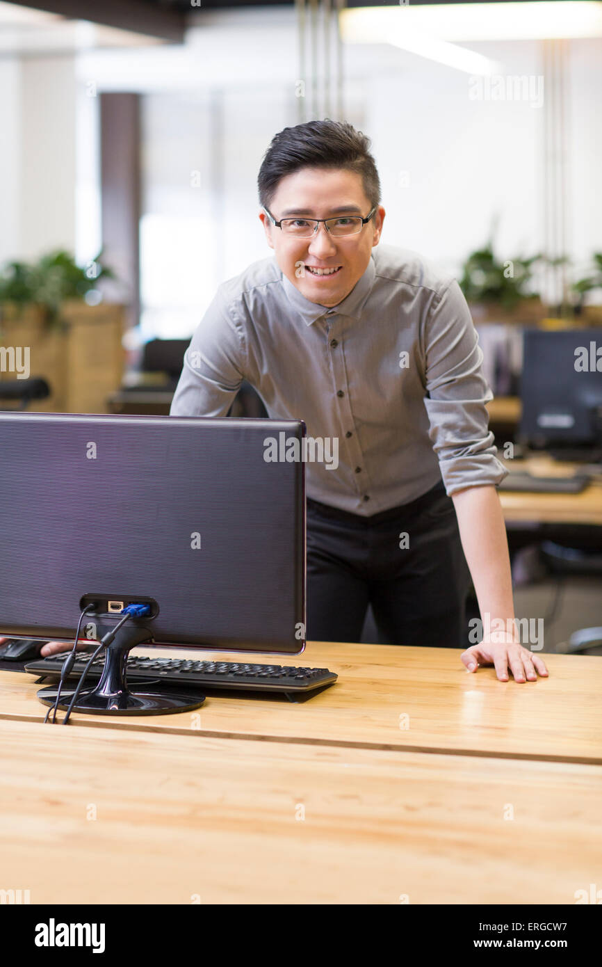IT worker working in office Stock Photo - Alamy