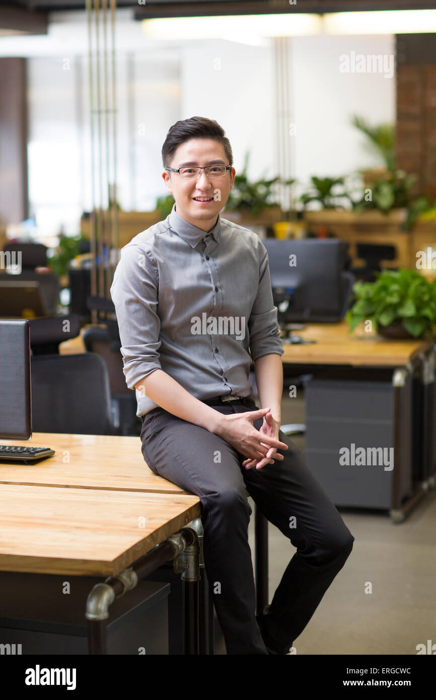 IT worker sitting in office Stock Photo - Alamy