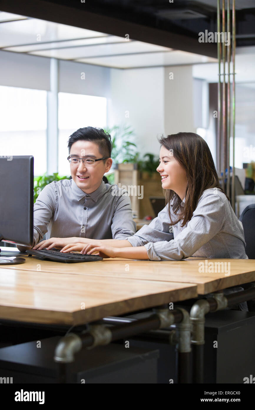 IT workers talking in office Stock Photo - Alamy