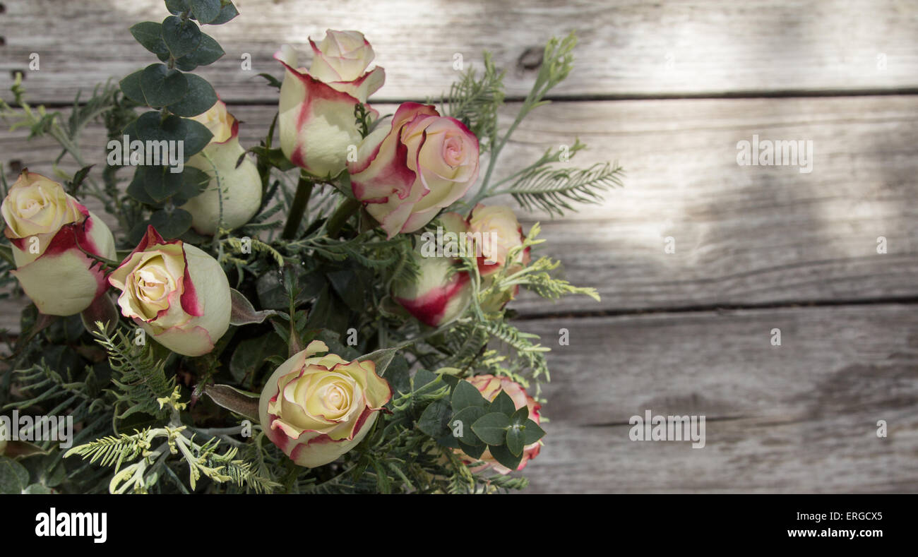 A bouquet of osira roses at a wedding in the countryside of France on ...