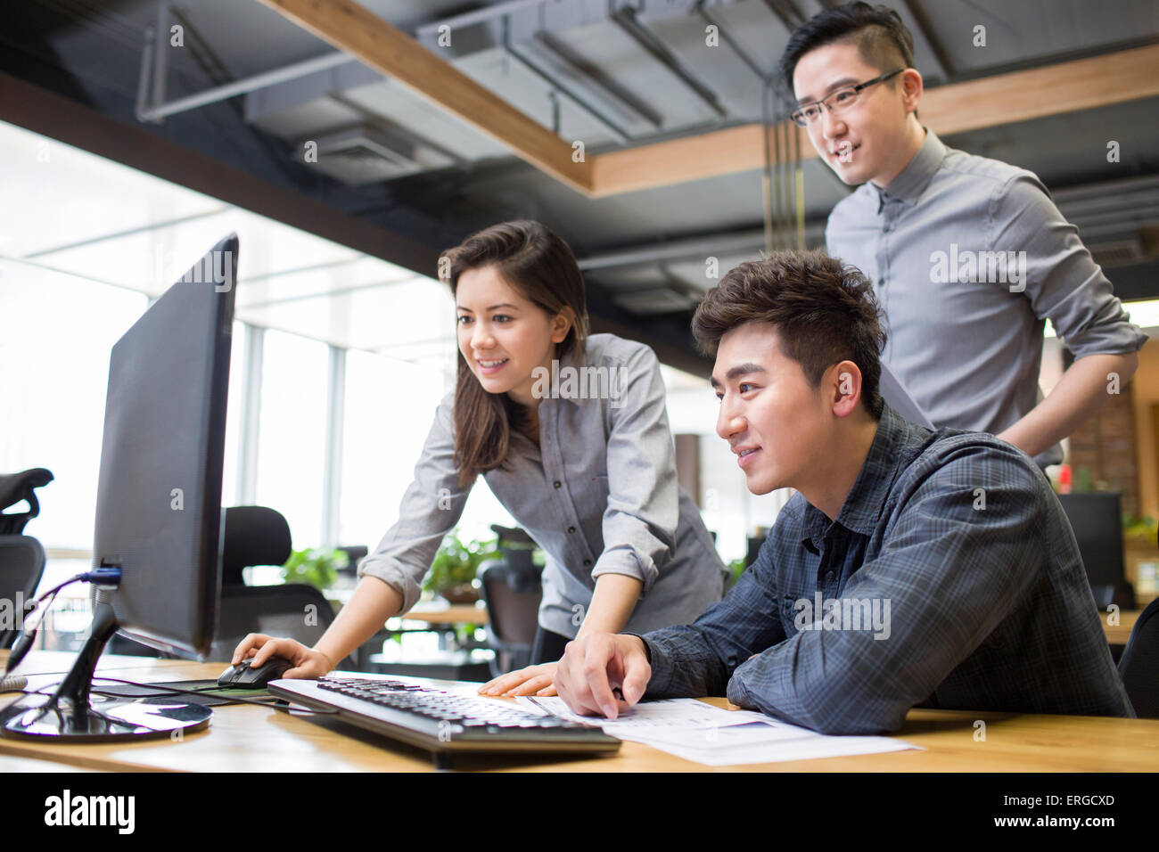 IT workers talking in office Stock Photo - Alamy