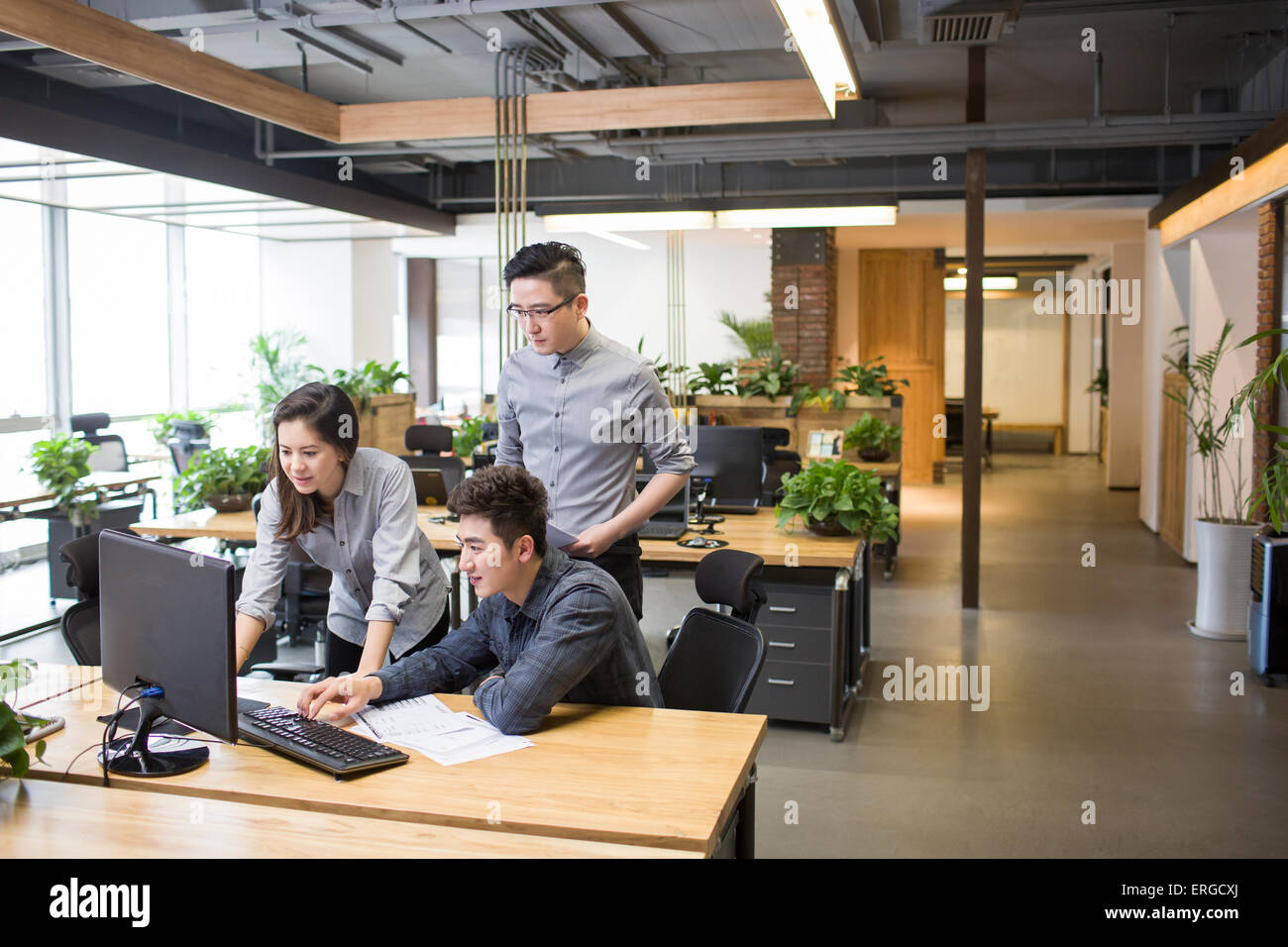 IT workers talking in office Stock Photo - Alamy