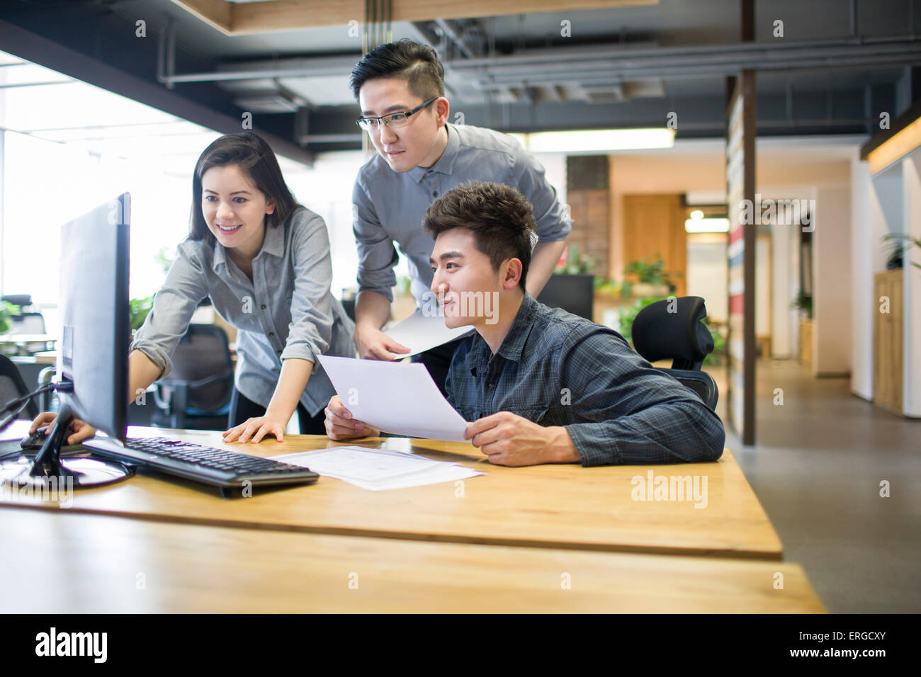 IT workers working in office Stock Photo - Alamy