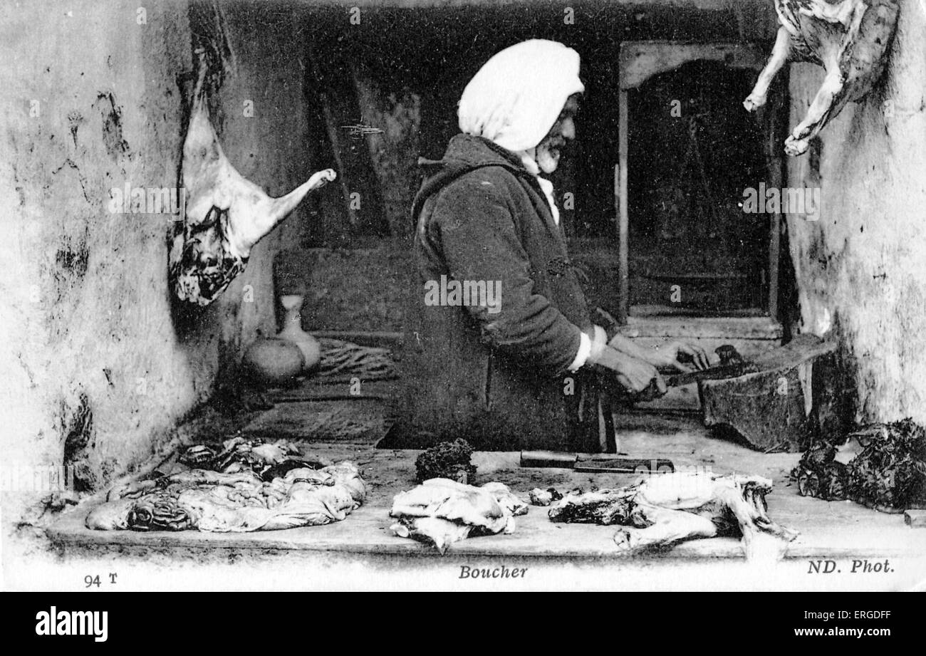 Butcher, France. Man preparing meat for consumption Stock Photo - Alamy