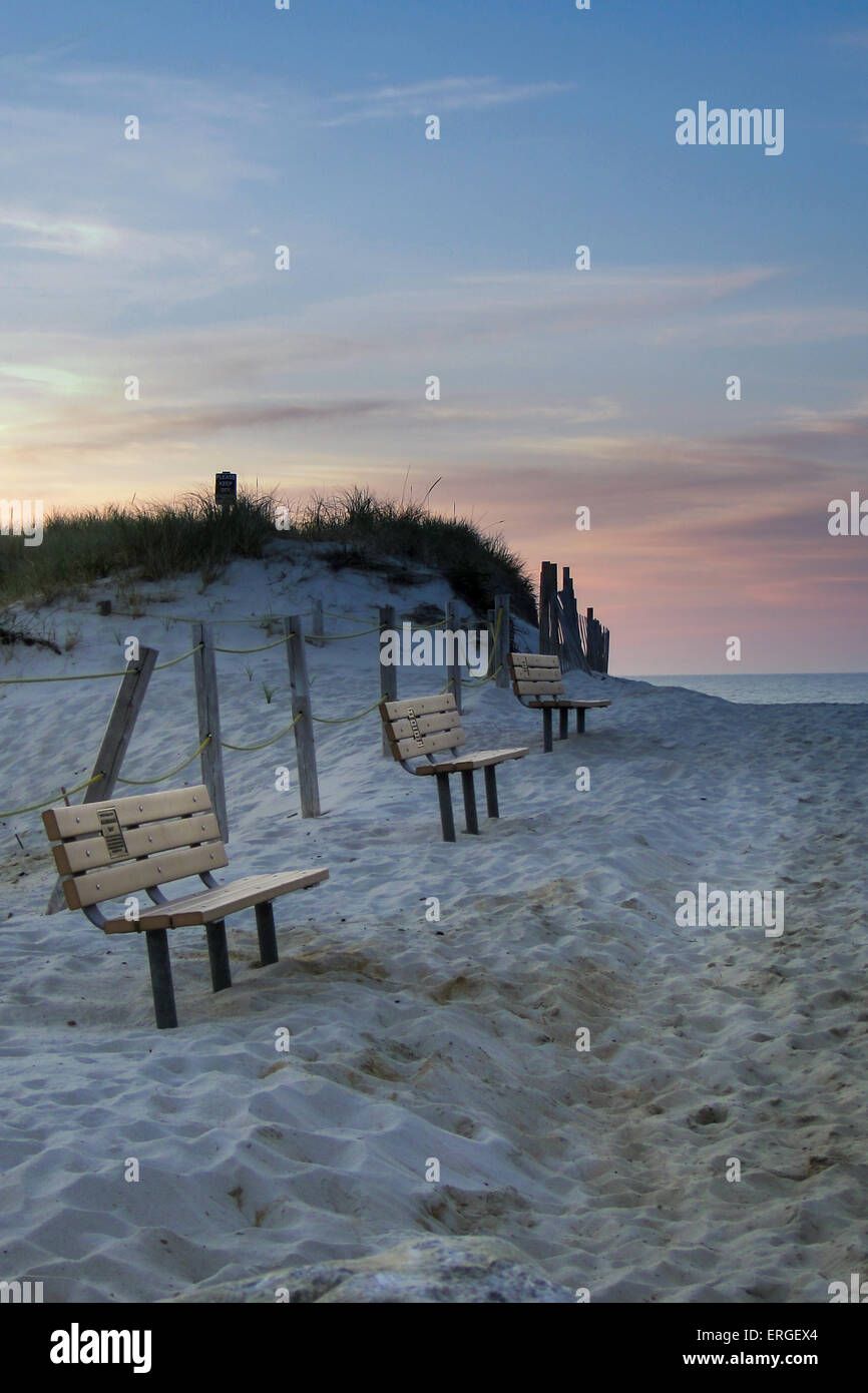 Cape Cod beach benches at Sunset Stock Photo - Alamy