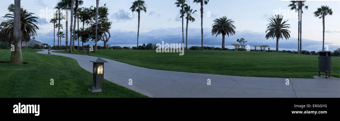 Walkway with lights at sunset Stock Photo - Alamy
