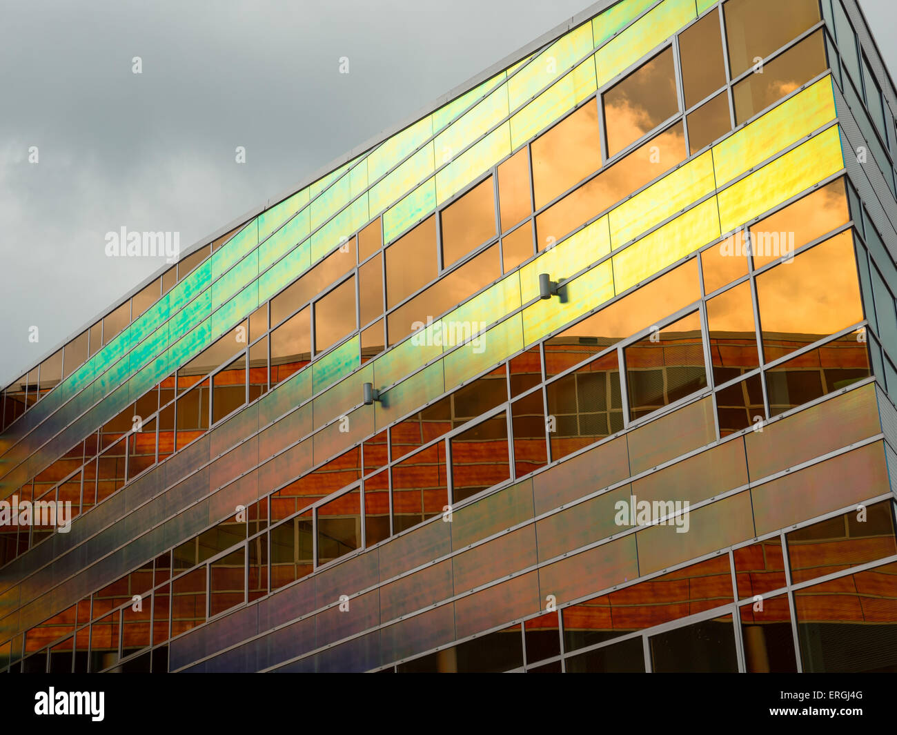 Colorful glass office building in European city Stock Photo - Alamy