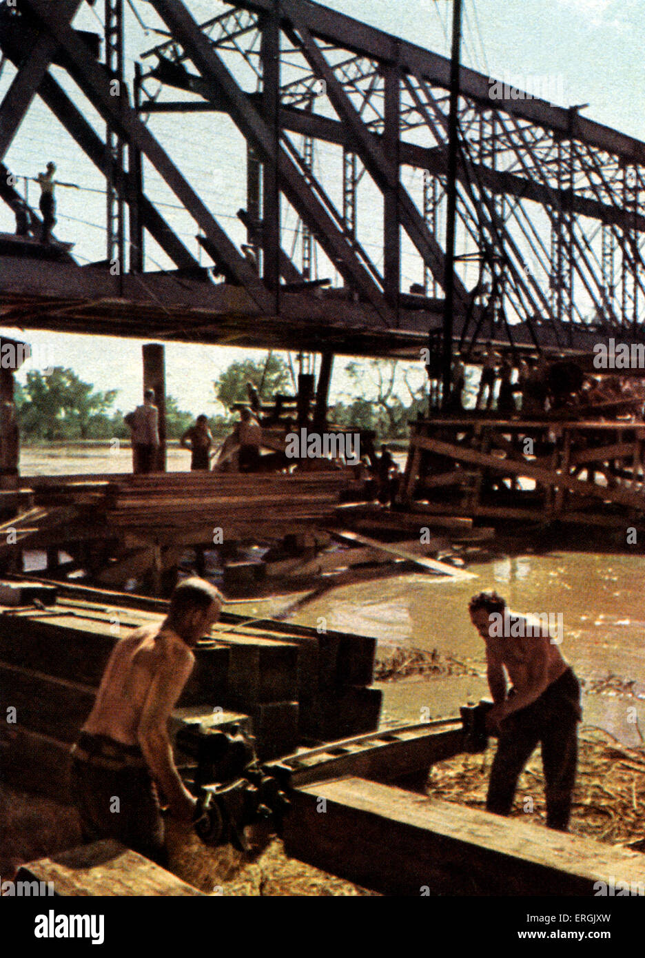 German pontoon sappers constructing a bridge during World War 2 ...