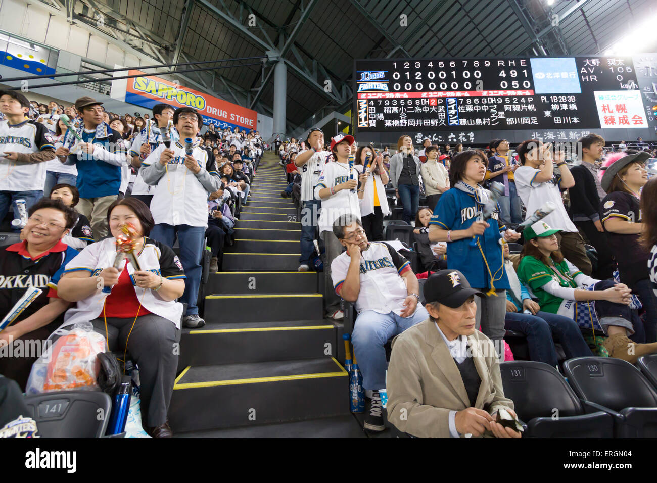 A giant crowd of people at the Sapporo Dome in Sapporo, Hokkaido gather ...