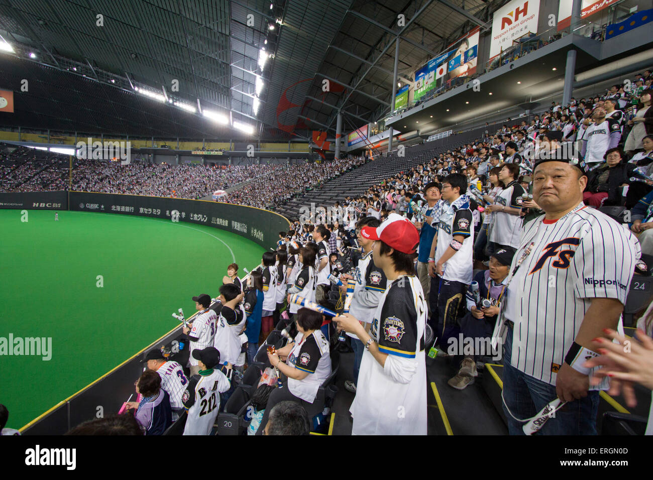 A giant crowd of people at the Sapporo Dome in Sapporo, Hokkaido gather ...