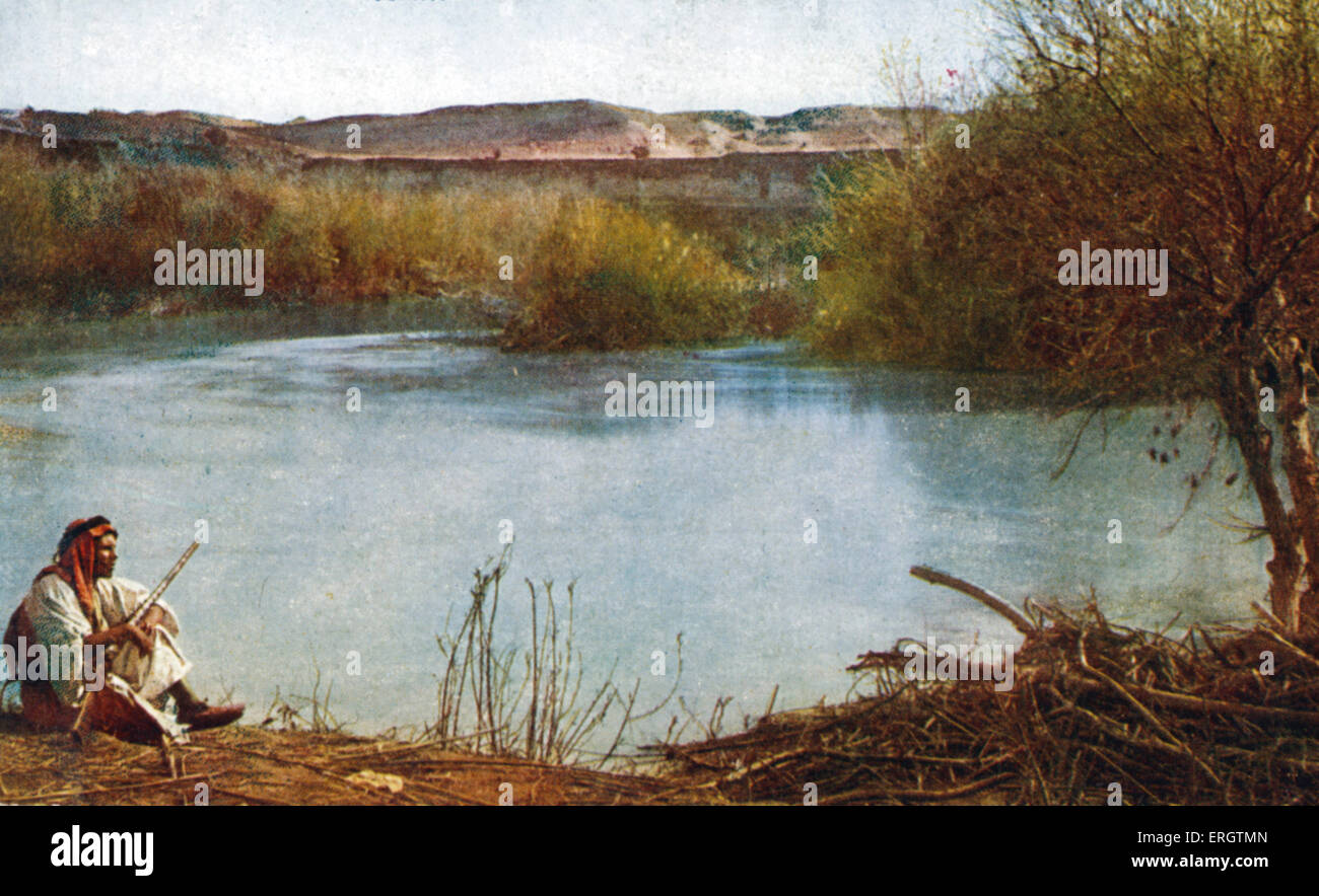 Jordan river - Arab hunter seated on river bank. Holy Land Stock Photo ...