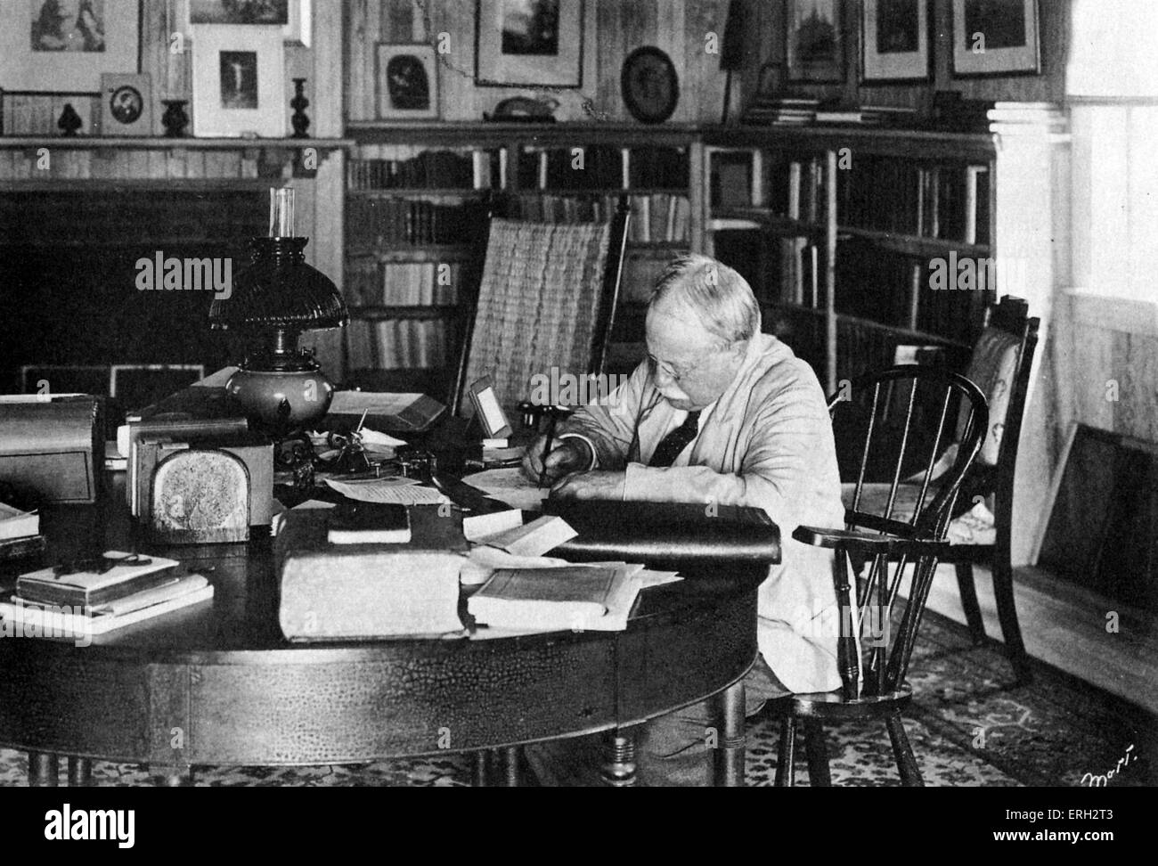 William Dean Howells writing at his desk at home, 225 Beacon Street ...