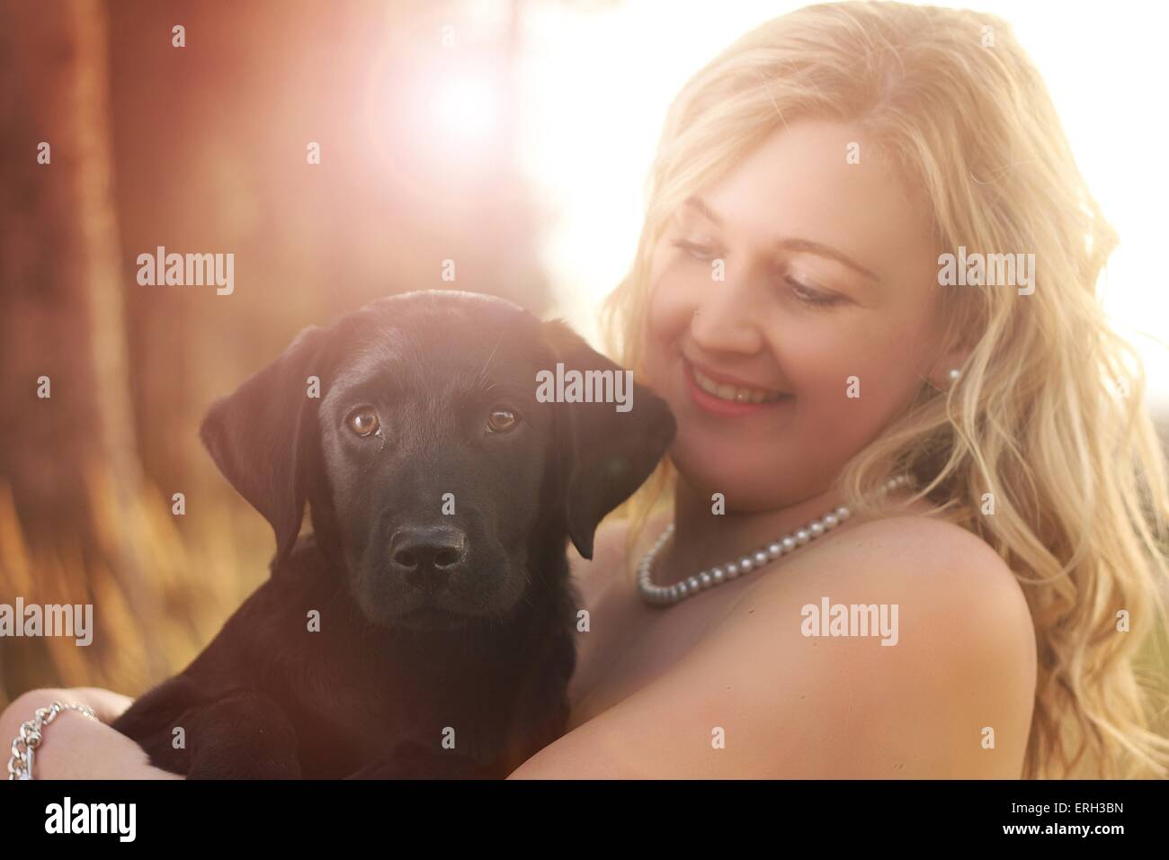 Woman black labrador retriever dog hi-res stock photography and images ...