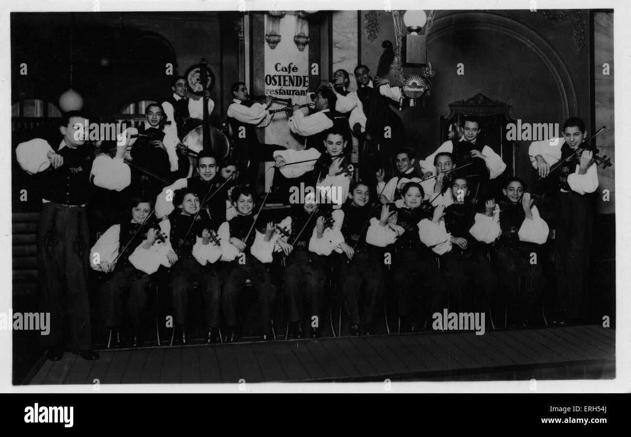 Hungarian Gypsy band in Café Ostende, Budapest, Hungary. Children and ...