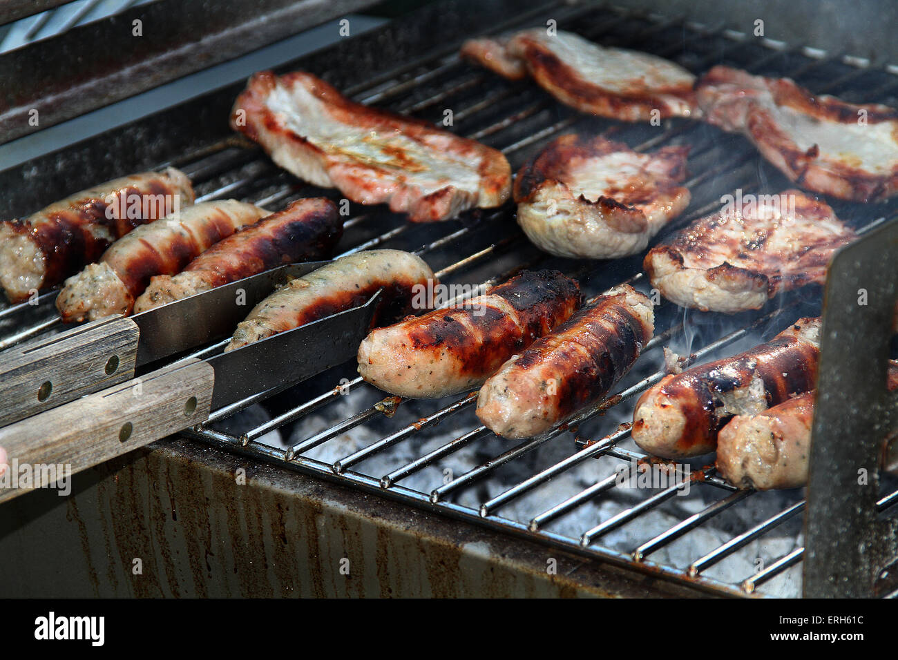 Food cooking on home barbecue over hot charcoal Stock Photo - Alamy