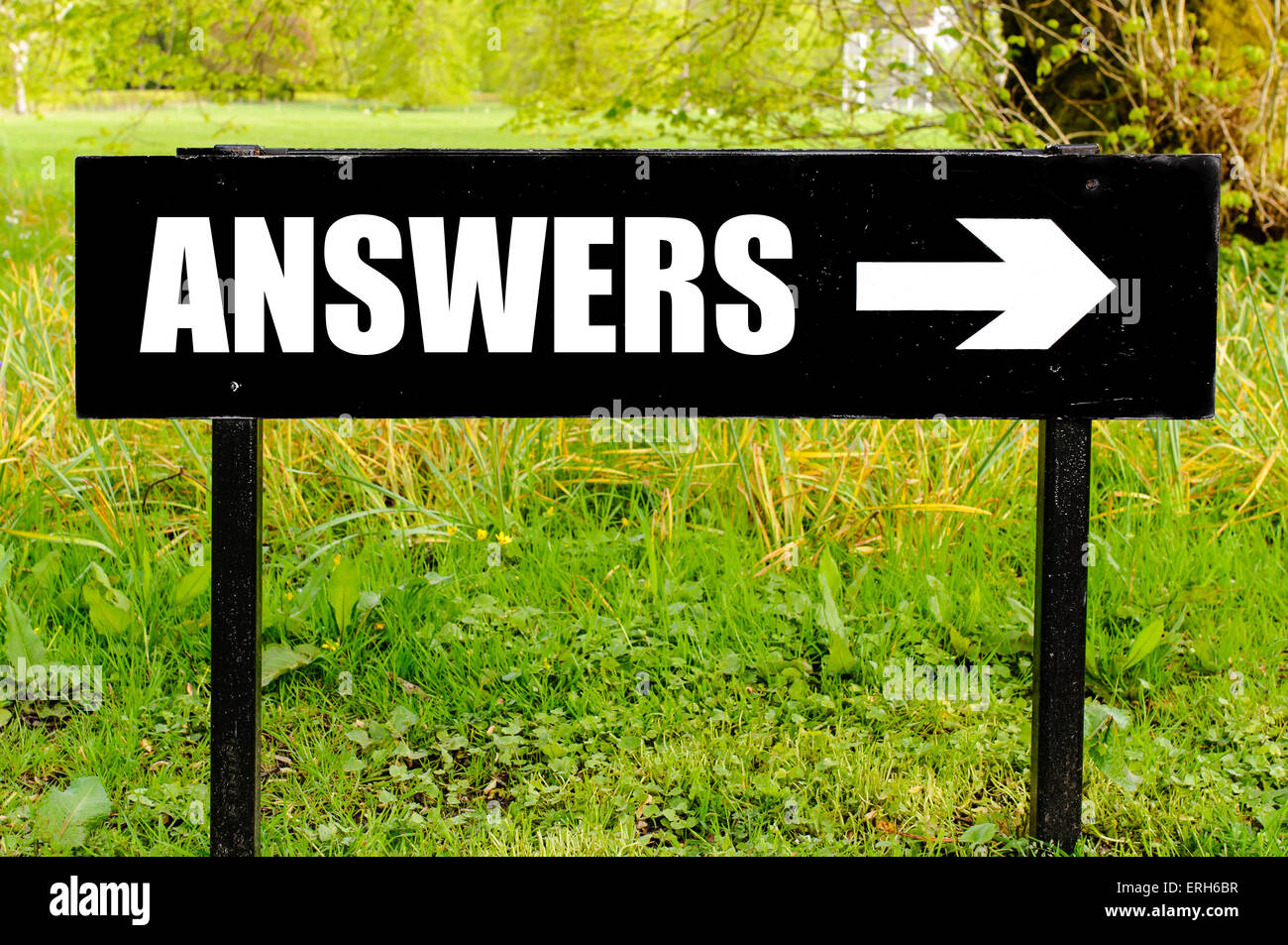 ANSWERS written on directional black metal sign with arrow pointing to ...