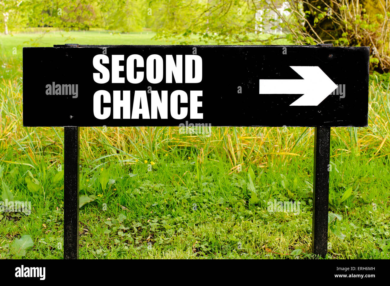 SECOND CHANCE written on directional black metal sign with arrow ...