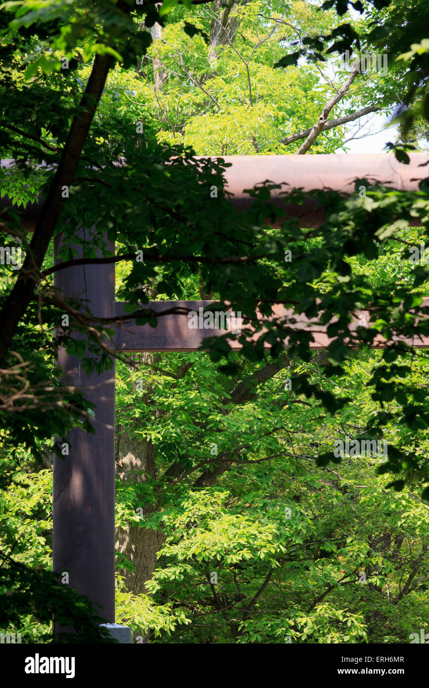 A giant stone torii gate marks the entrance to Hokkaido Jingu in ...