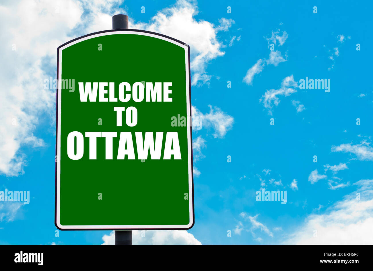 Green road sign with greeting message Welcome to OTTAWA isolated over ...
