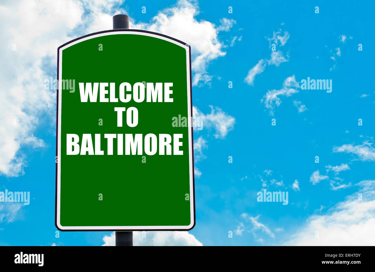 Green road sign with greeting message Welcome to BALTIMORE isolated ...