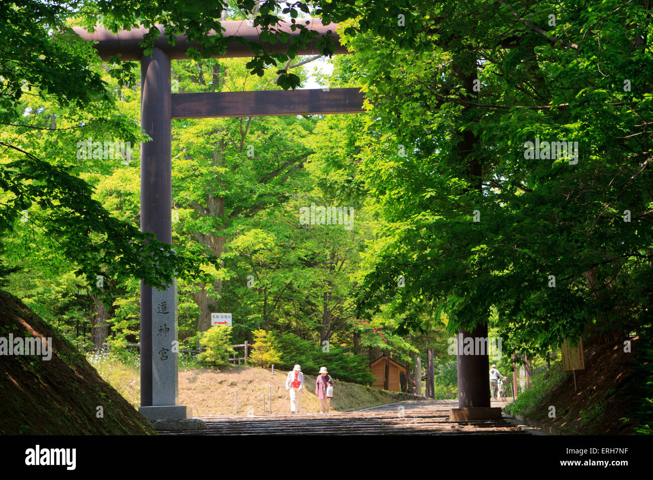 A giant stone torii gate marks the entrance to Hokkaido Jingu in ...