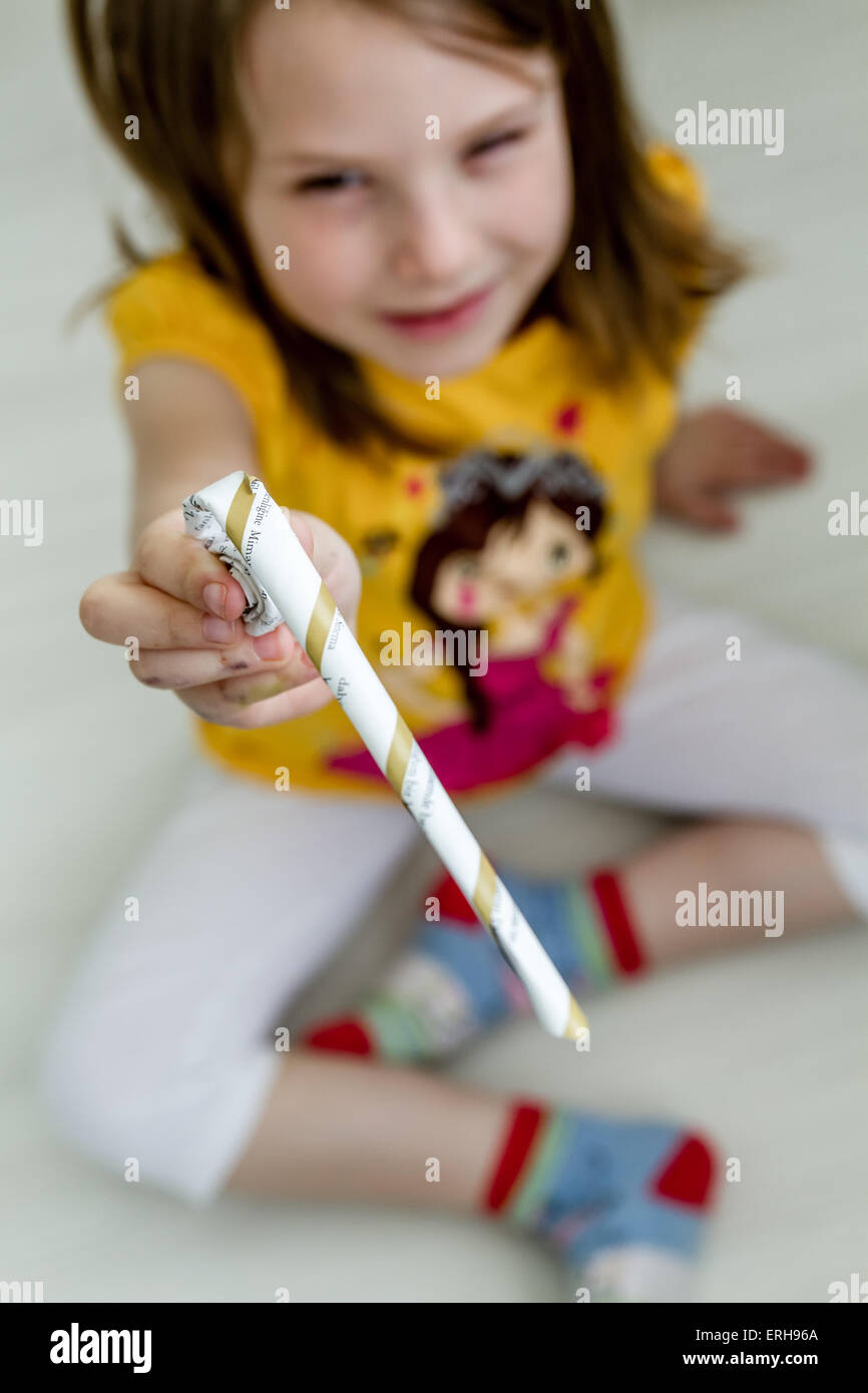 Little girl working on creative diy project from waste magazine Stock ...