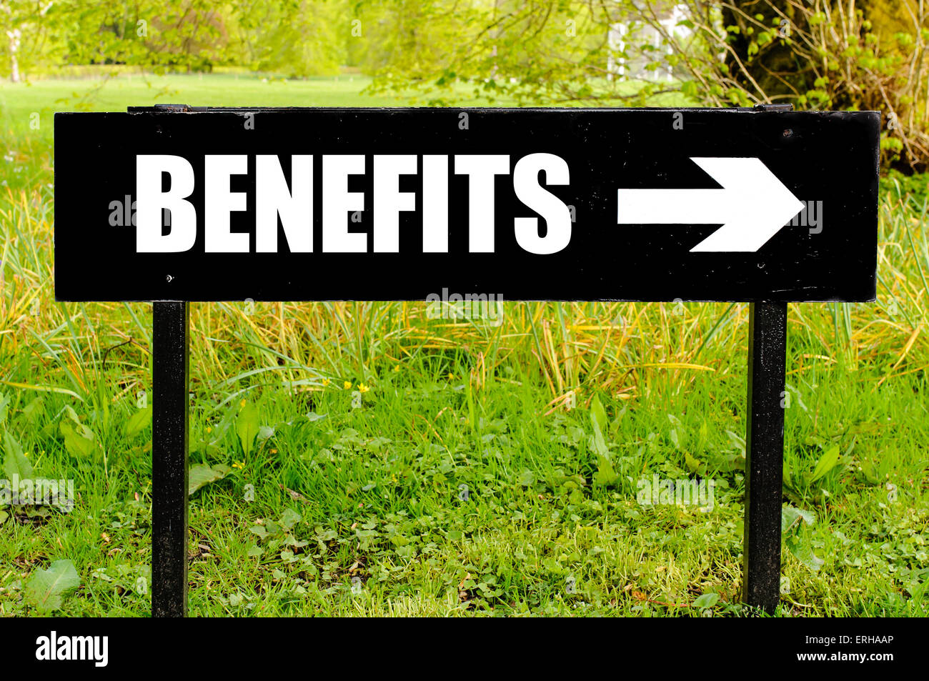 BENEFITS written on directional black metal sign with arrow pointing to ...