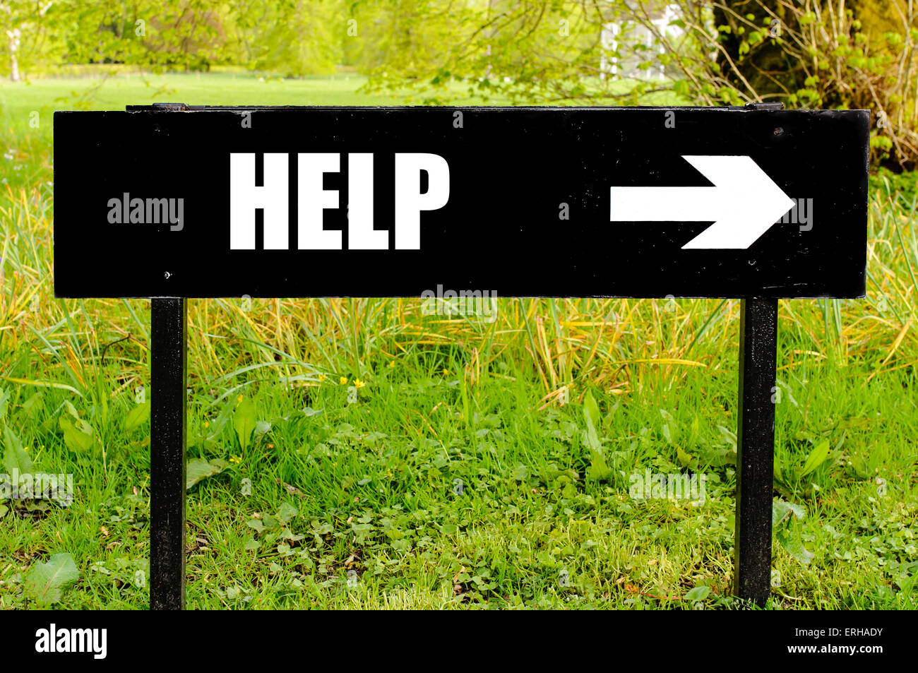 HELP written on directional black metal sign with arrow pointing to the ...