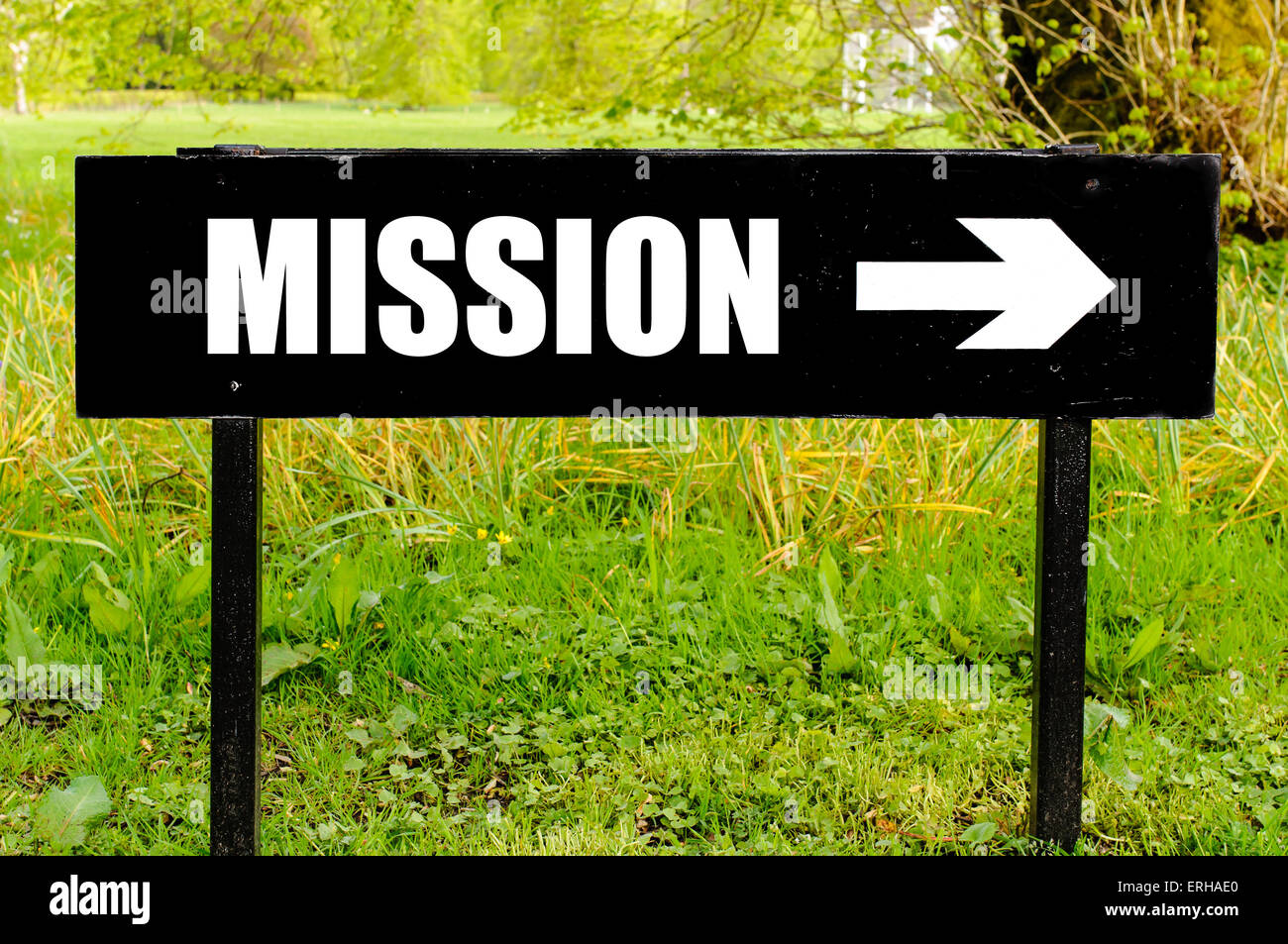 MISSION written on directional black metal sign with arrow pointing to ...