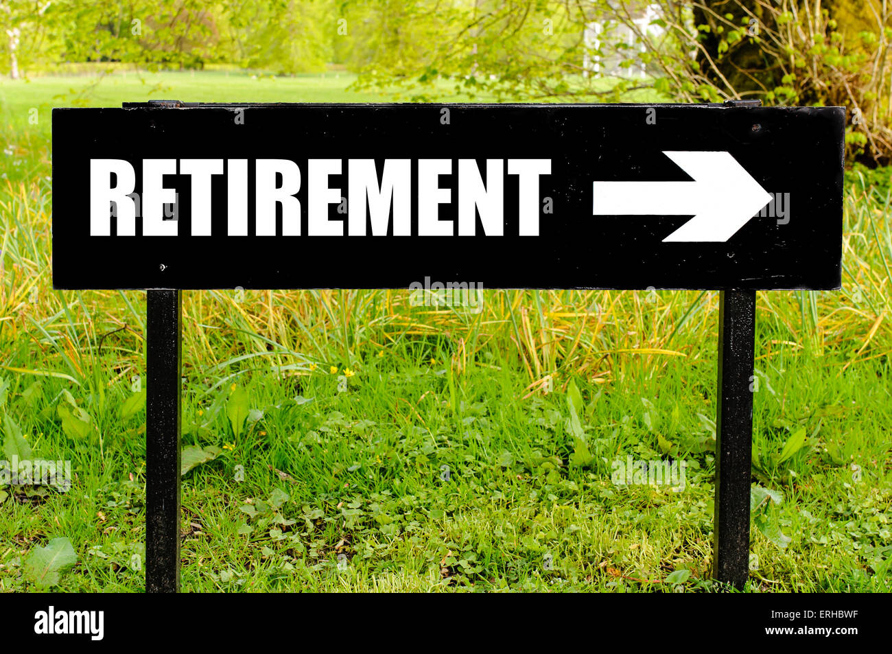 RETIREMENT written on directional black metal sign with arrow pointing ...