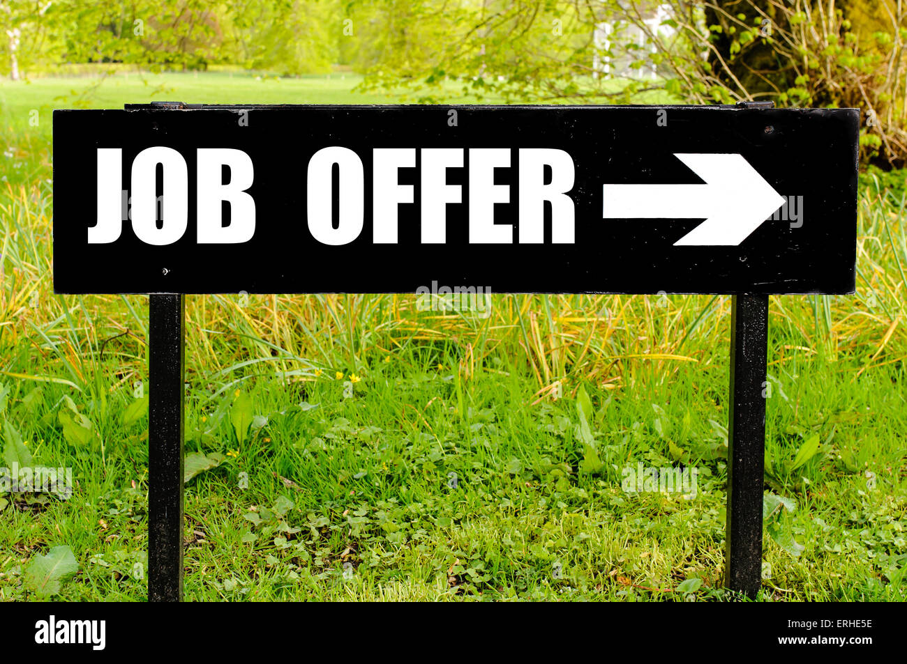 JOB OFFER written on directional black metal sign with arrow pointing ...