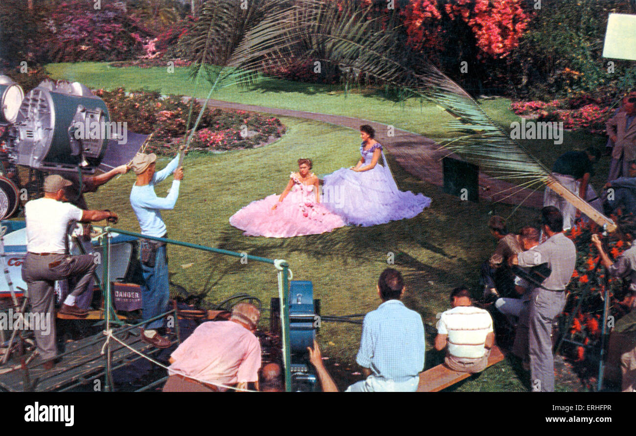Hollywood movie set. Two unidentified actresses being filmed surrounded ...