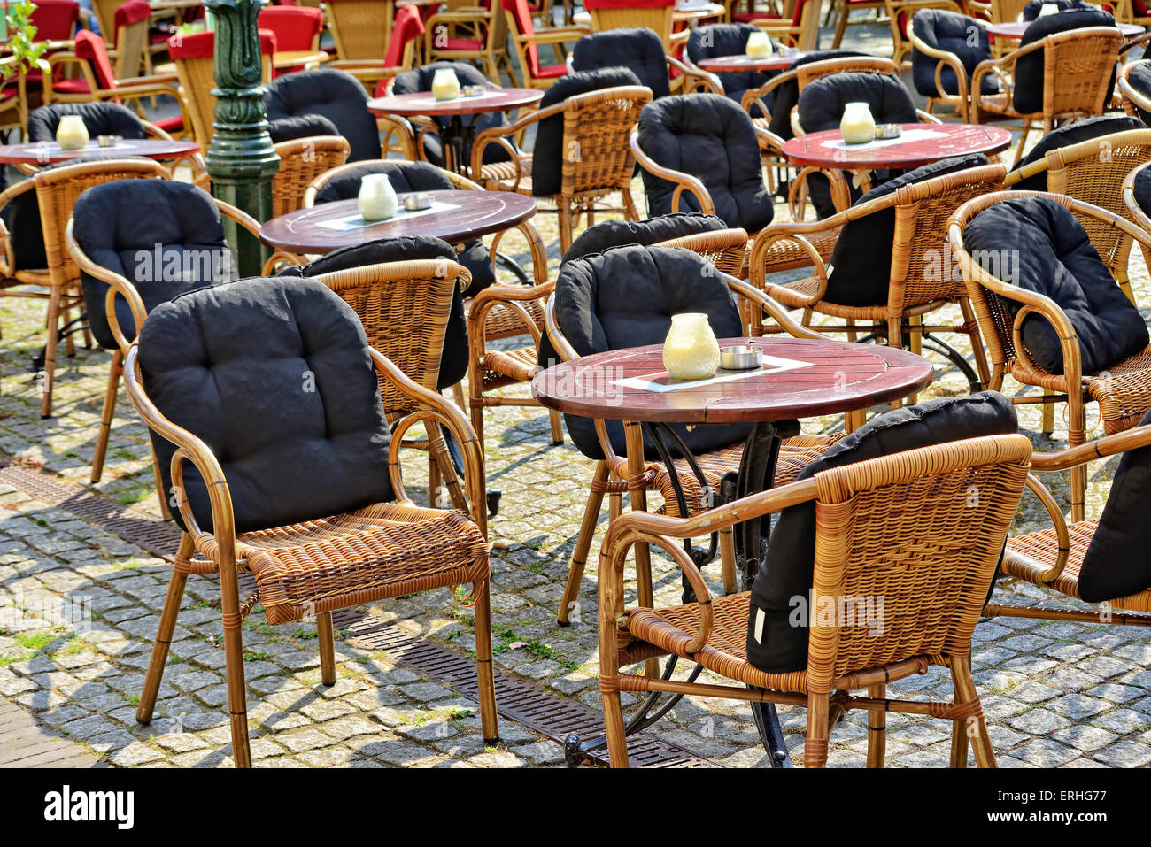 Tables of traditional outdoors cafe in European city in bright sunny ...